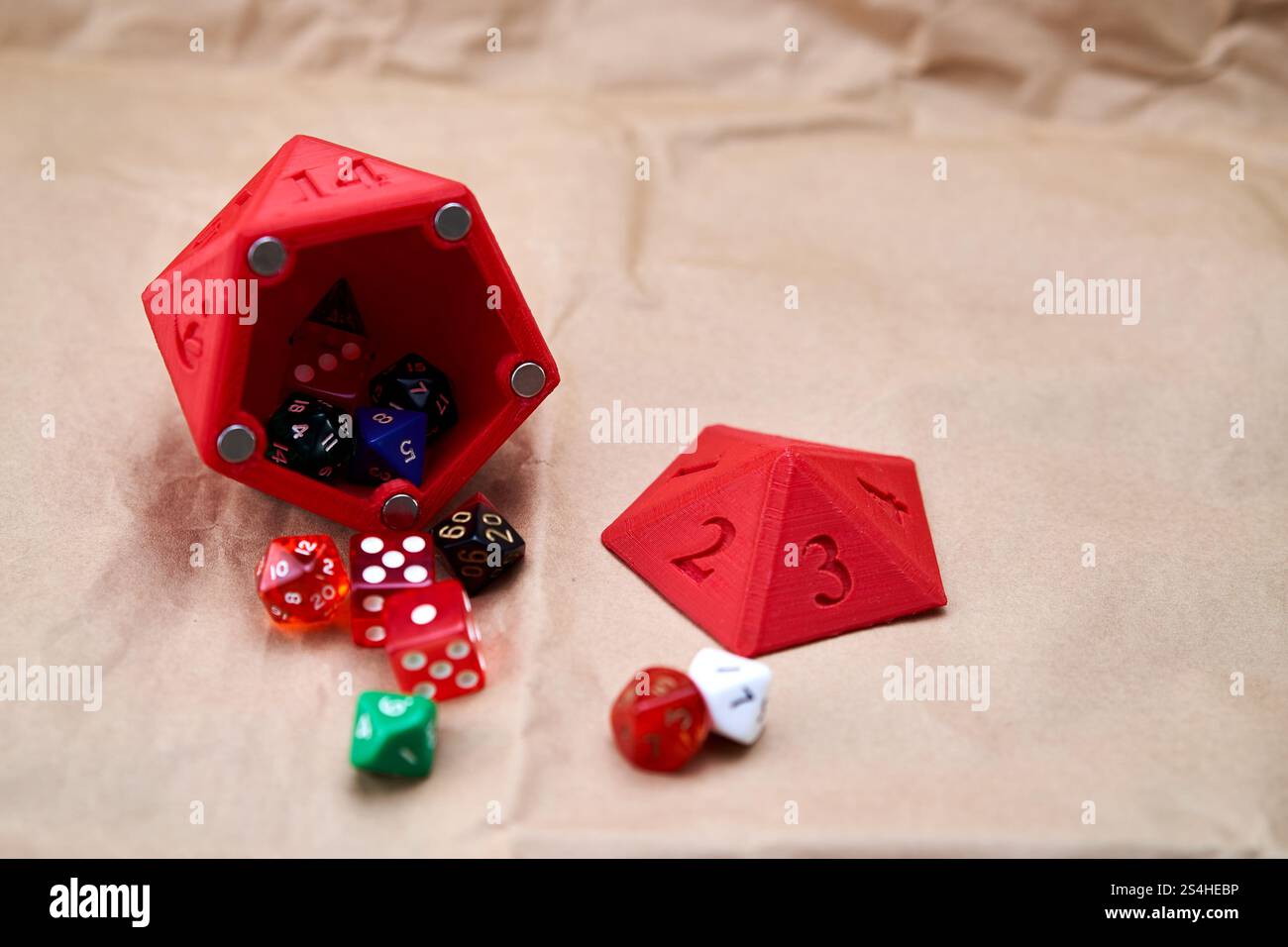 Diverse collection of colored dice on a cardboard surface Stock Photo ...