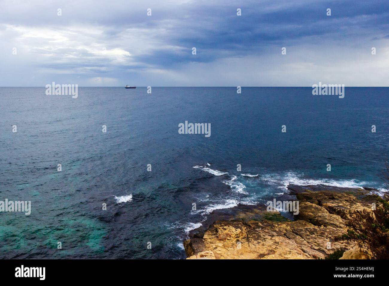 A beautiful coastal cliffside view showcases rocky terrain, lush ...