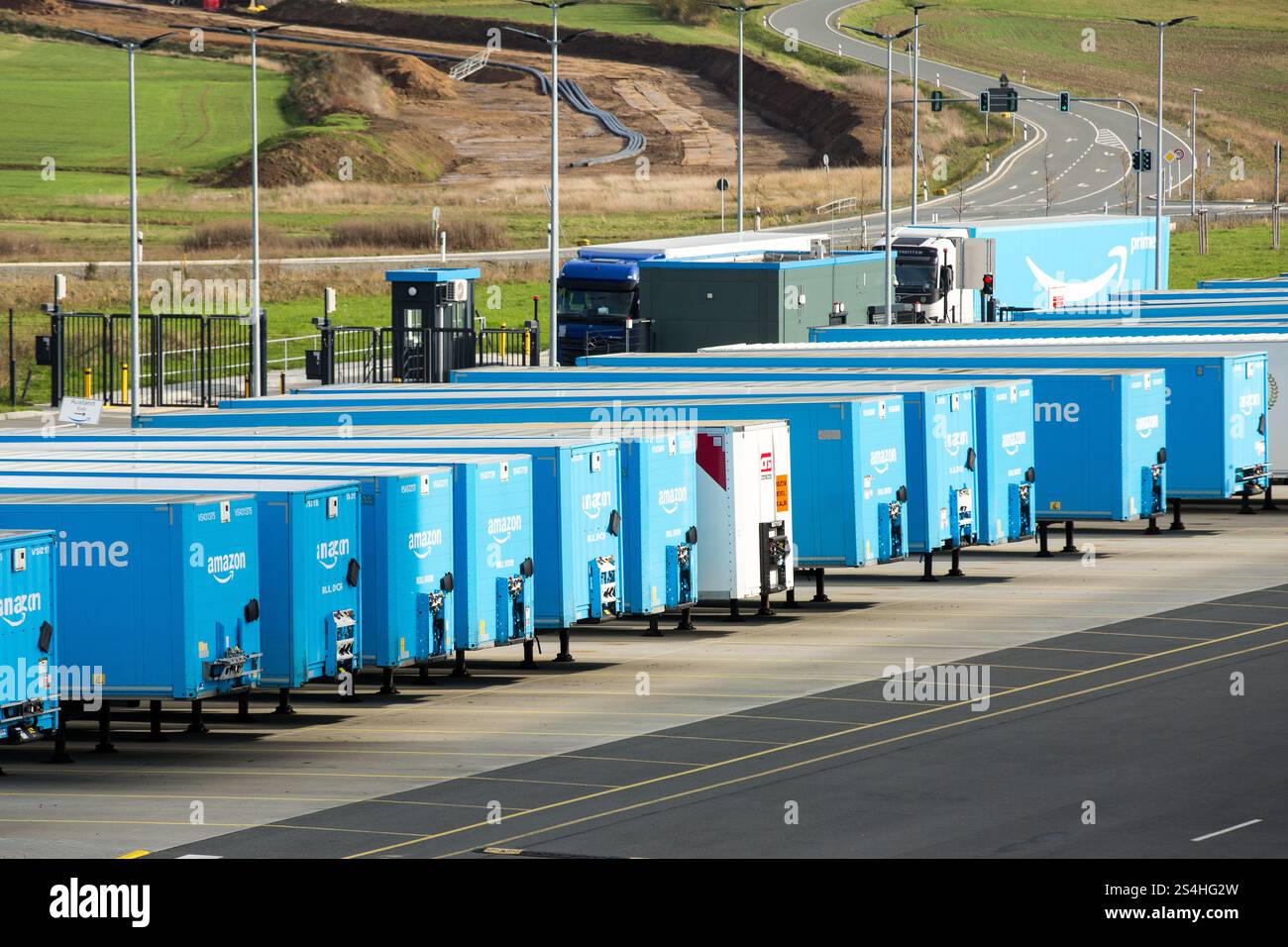 Amazon branded trailers are seen in front of Amazon Logistics Center ...