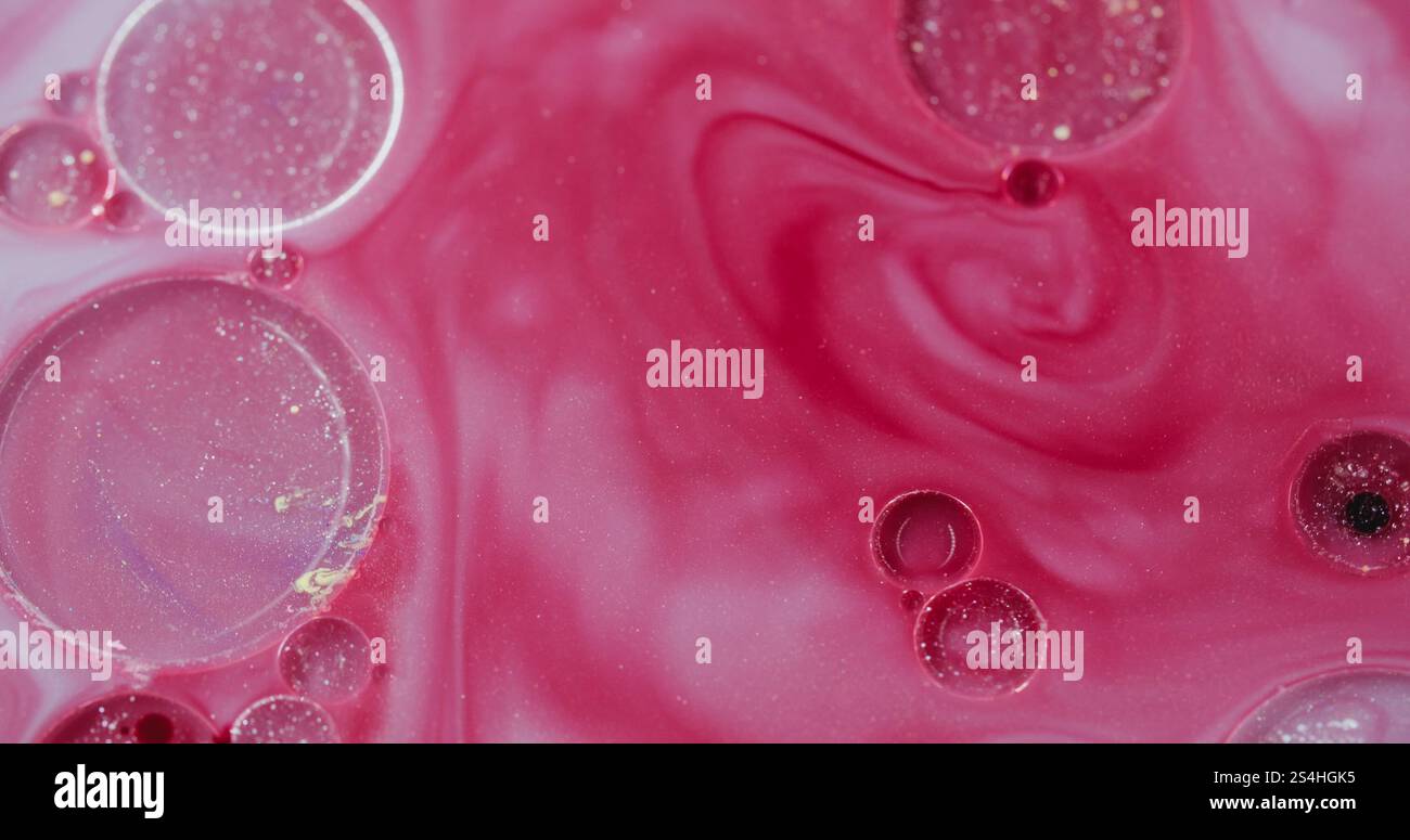 Paint bubble flow. Marble liquid stirring. Swirling drop oil. Pink ...