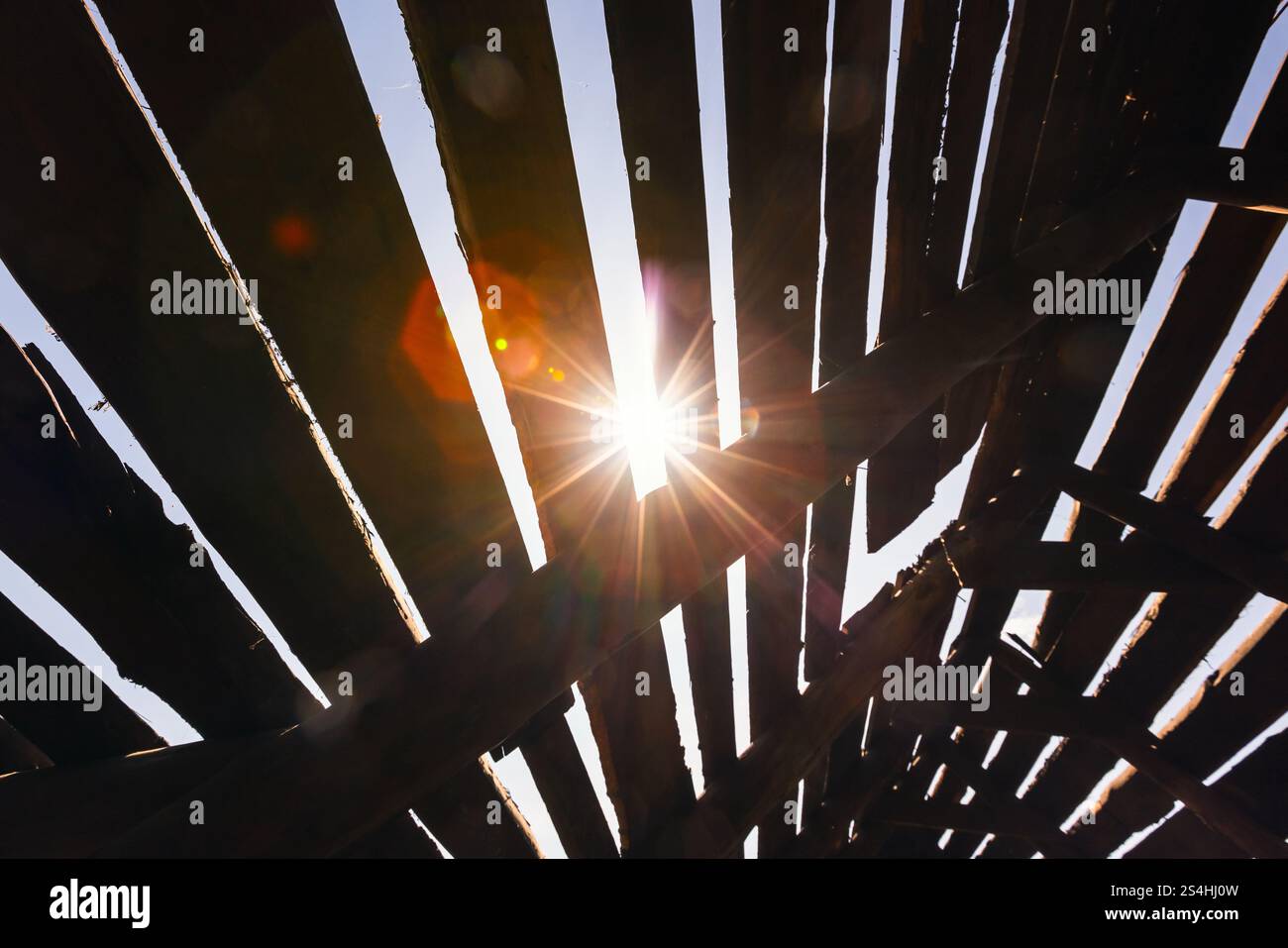 Sun is shining through an abandoned broken roof, background photography ...