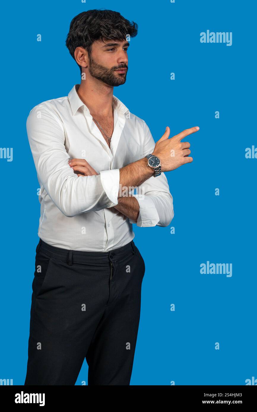 Confident businessman wearing white shirt pointing with index finger ...