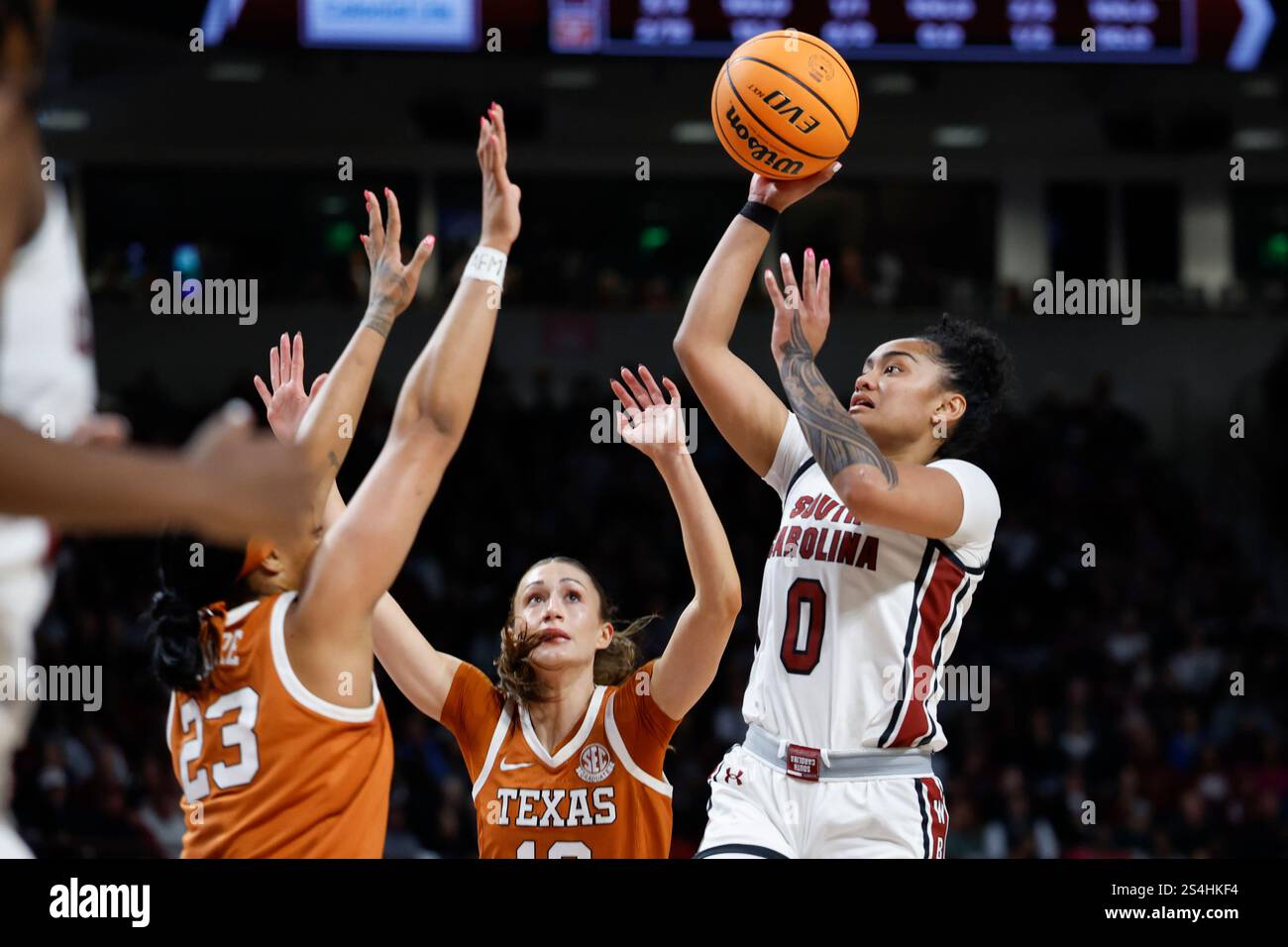 South Carolina guard Te-Hina Paopao (0) shoots over Texas forward Aaliyah Moore (23) as guard ...