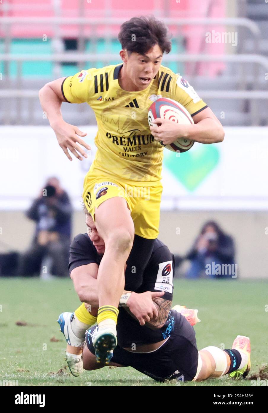 Tokyo, Japan. 12th Jan, 2025. Tokyo Suntory Sungoliath full back Ryosuke Kawase carries the ball ...