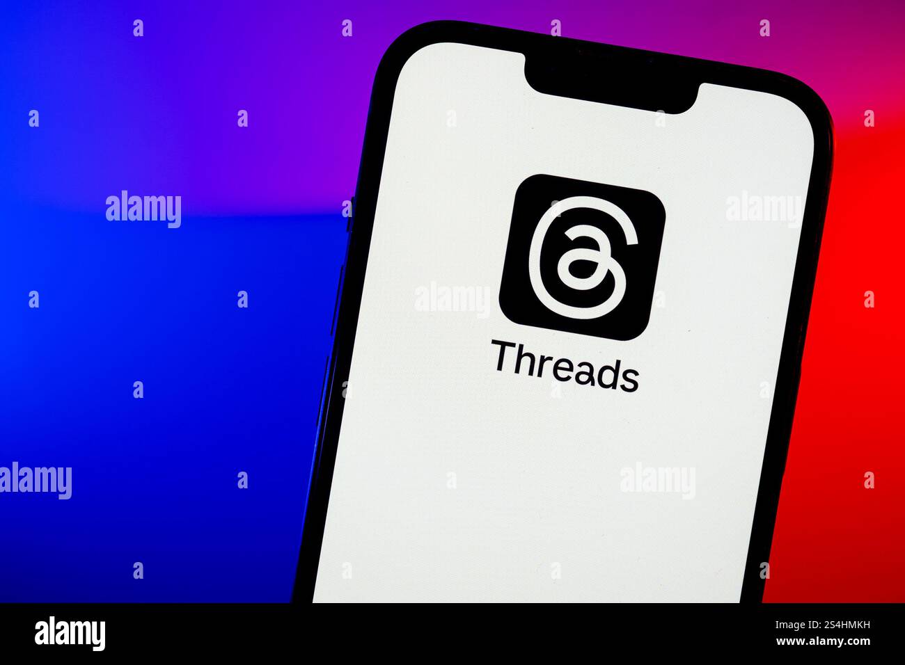 In this photo illustration, a Threads logo seen displayed on a ...