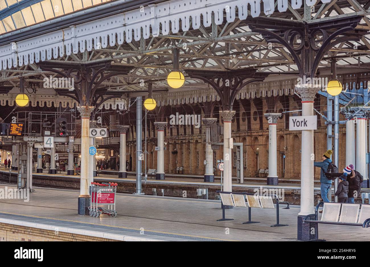 A 19th Century historic canopy supported by columns covers a railway ...