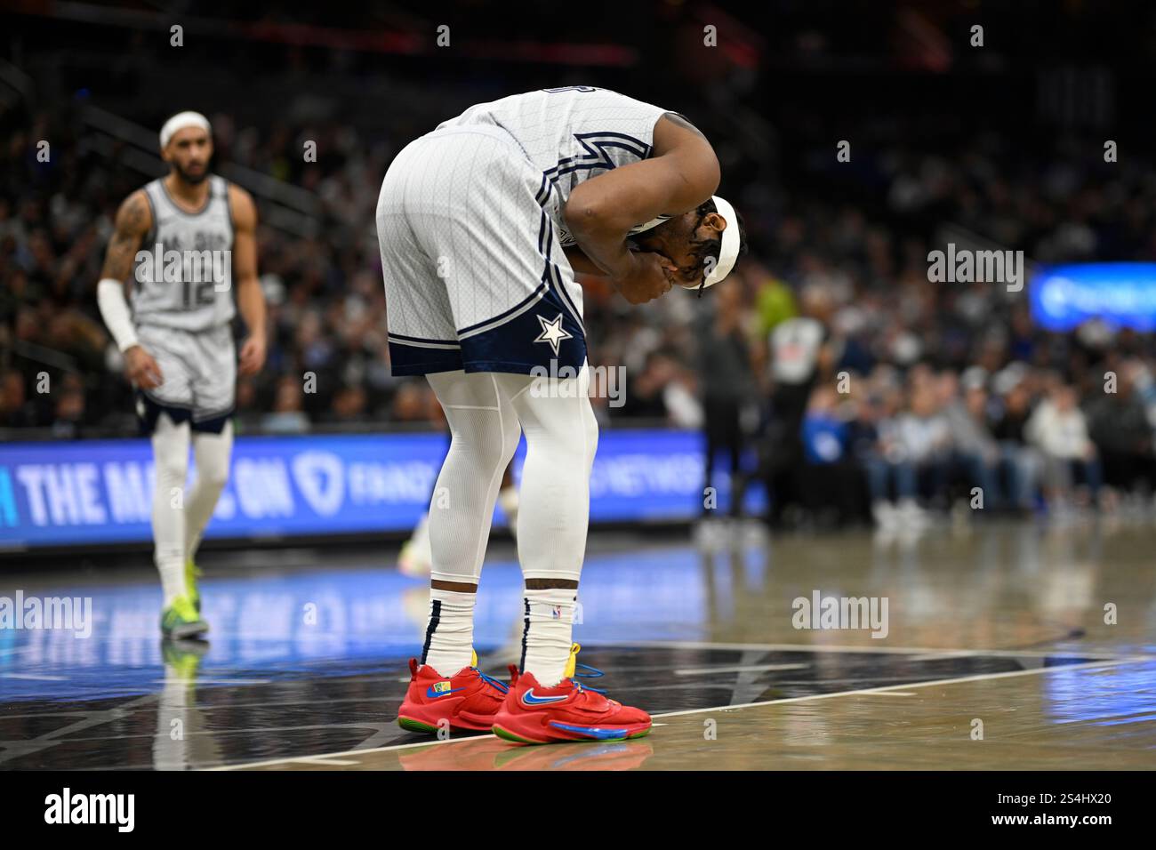 Orlando Magic center Wendell Carter Jr. holds his face after colliding ...