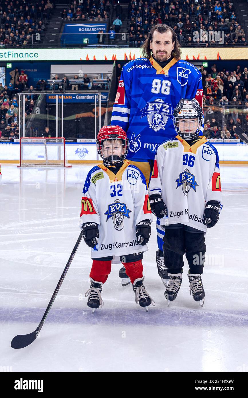 Daniel Vozenilek #96 (EV Zug) with his two children - 12.01.2025 ...