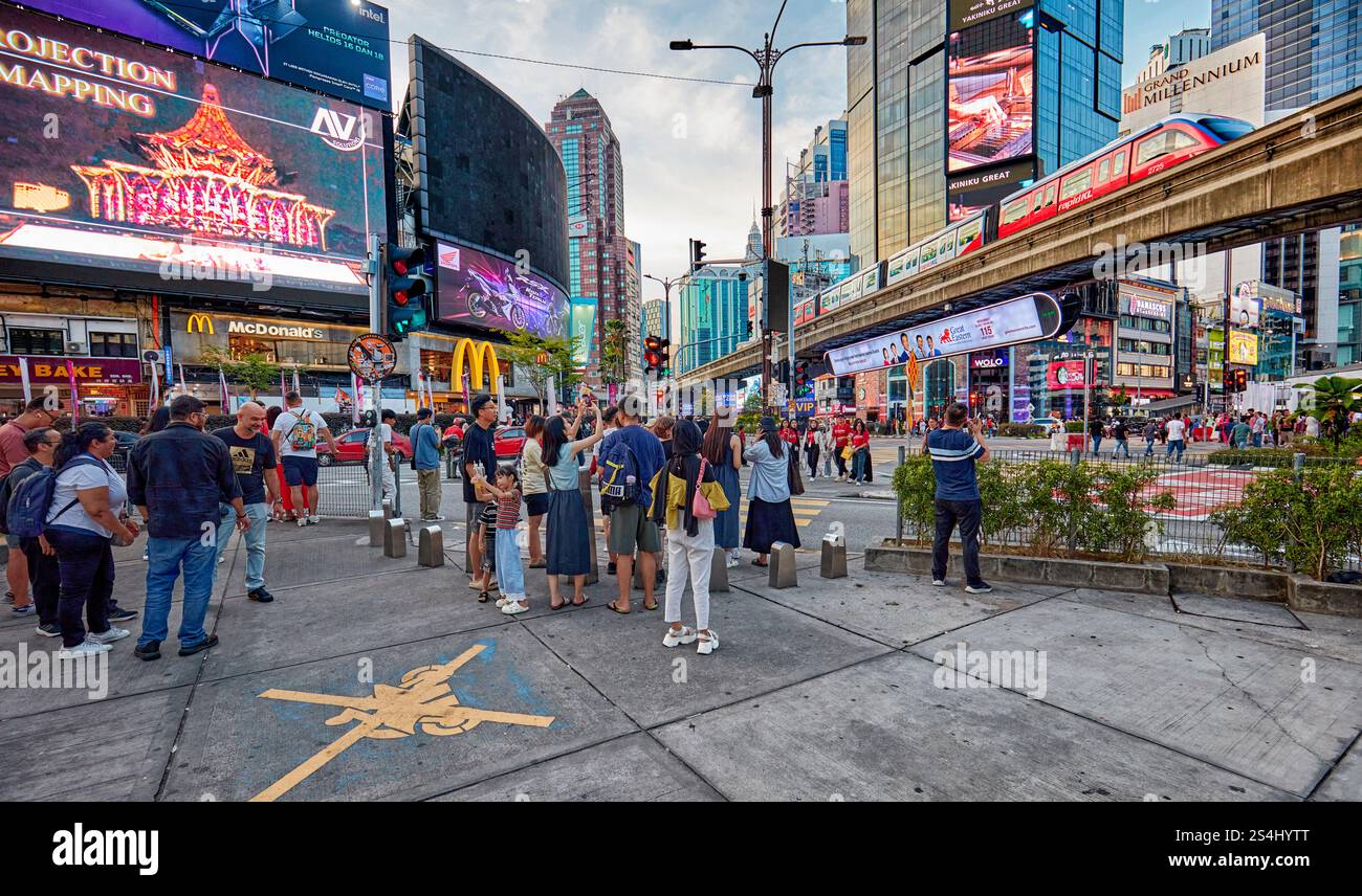 People wait for green light at the pedestrian crossing at the ...