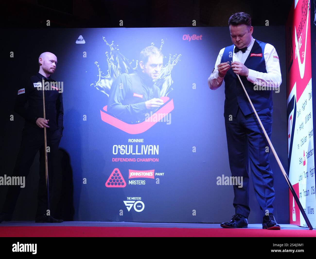 Gary Wilson (left) and Shaun Murphy prepare to walk out after the mid ...
