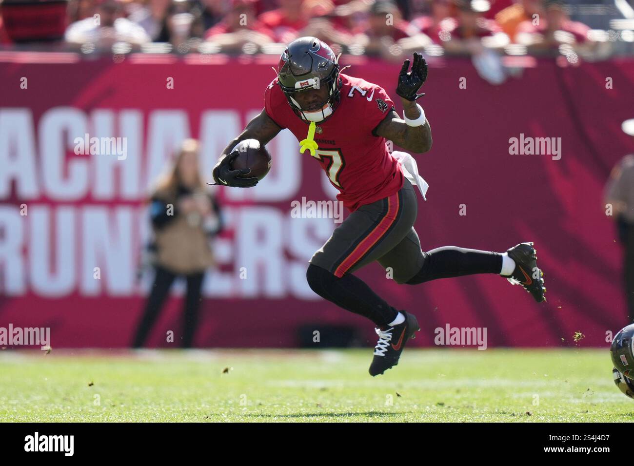 Tampa Bay Buccaneers running back Bucky Irving (7) tries to keep his ...