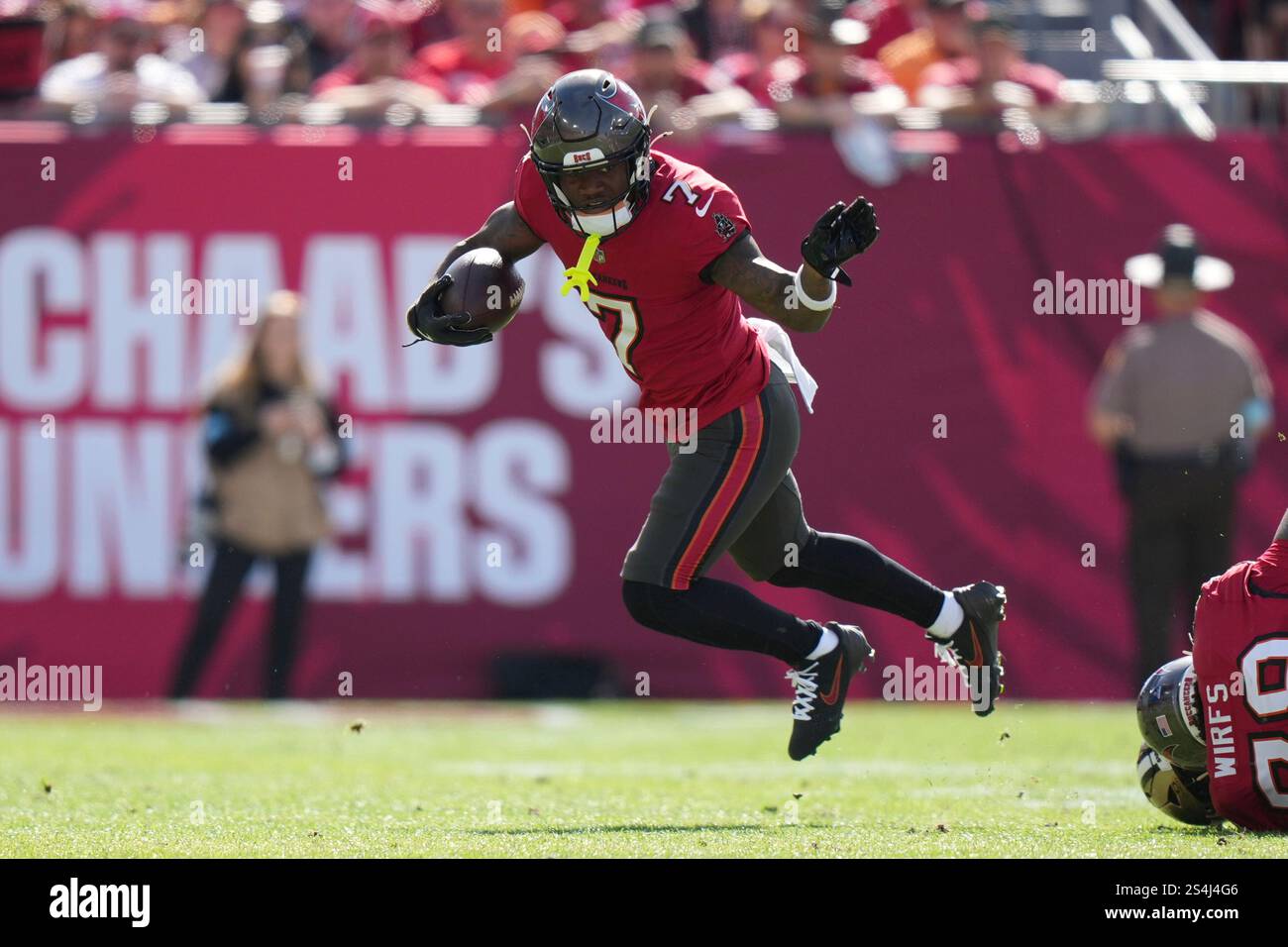 Tampa Bay Buccaneers running back Bucky Irving (7) tries to keep his ...