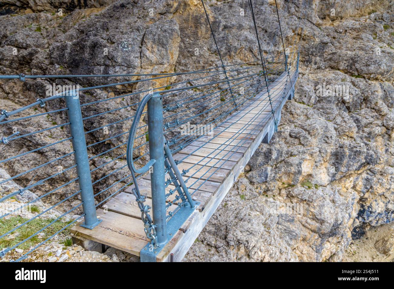 Via ferrata in the Dolomites. Equipped with bridge and steel cable ...