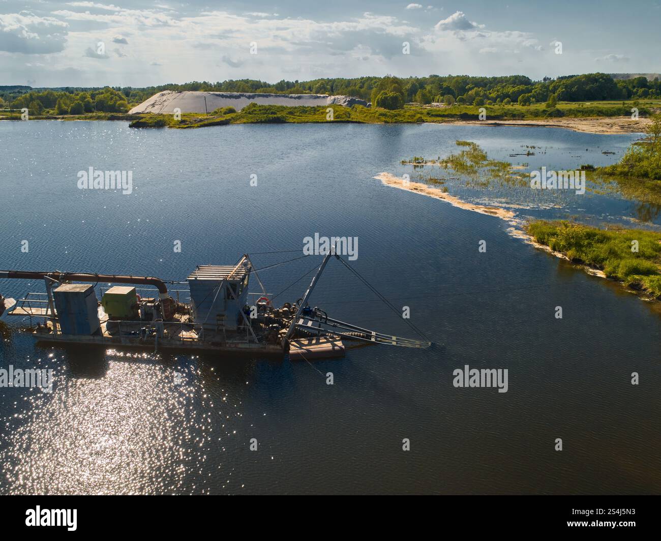 Suction dredger vessel works drawing up bottom mud on river Stock Photo ...