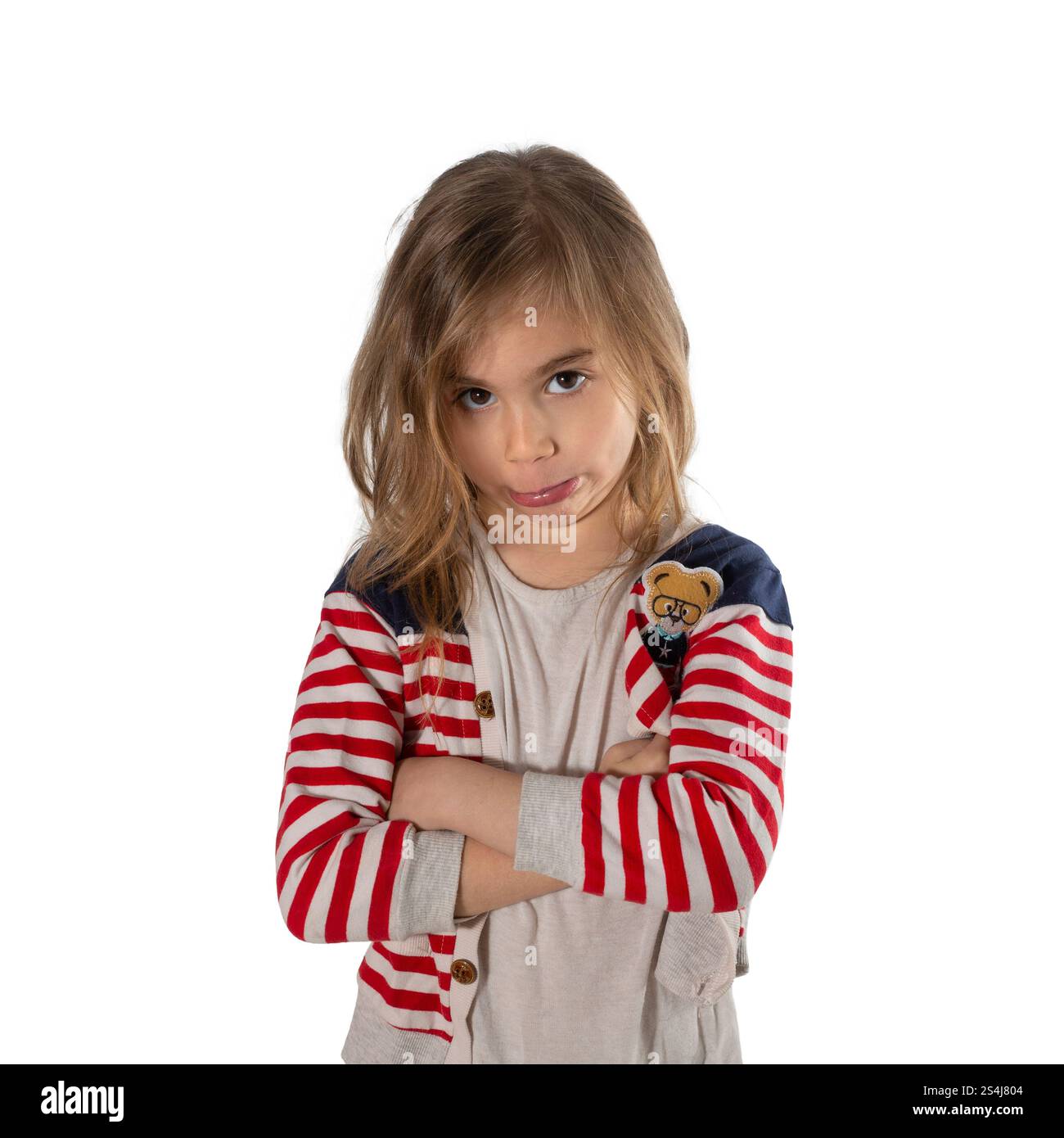 Portrait of a cute girl makes an unhappy expression. Photographed on a ...