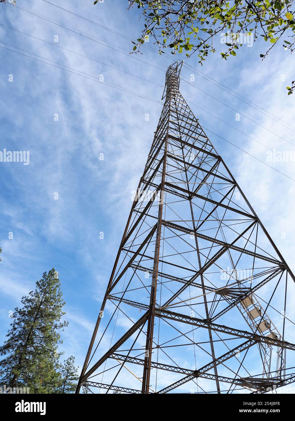 A very tall tower supporting overhead electrical power transmisson ...