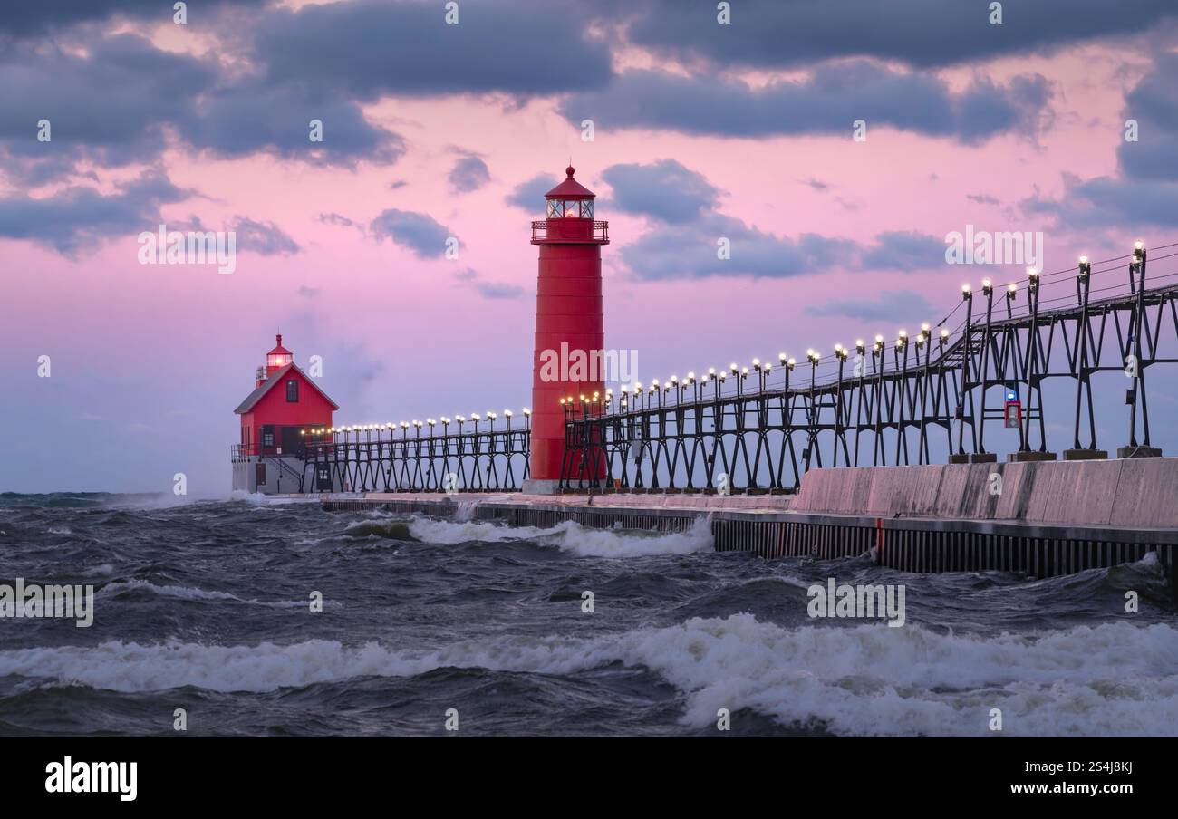 Grand Haven Lighthouse with pink sunrise Stock Photo - Alamy