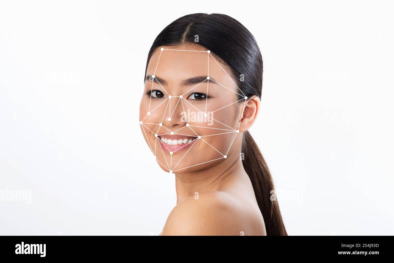 Facial recognition tech displayed on a young woman's face Stock Photo ...
