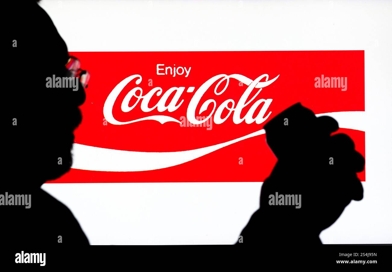 In this photo illustration, a Coca-Cola logo seen displayed on a ...