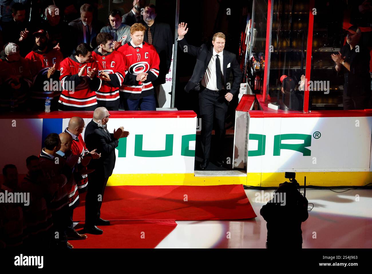 Former Carolina Hurricanes player Eric Staal, center, takes to the ice ...