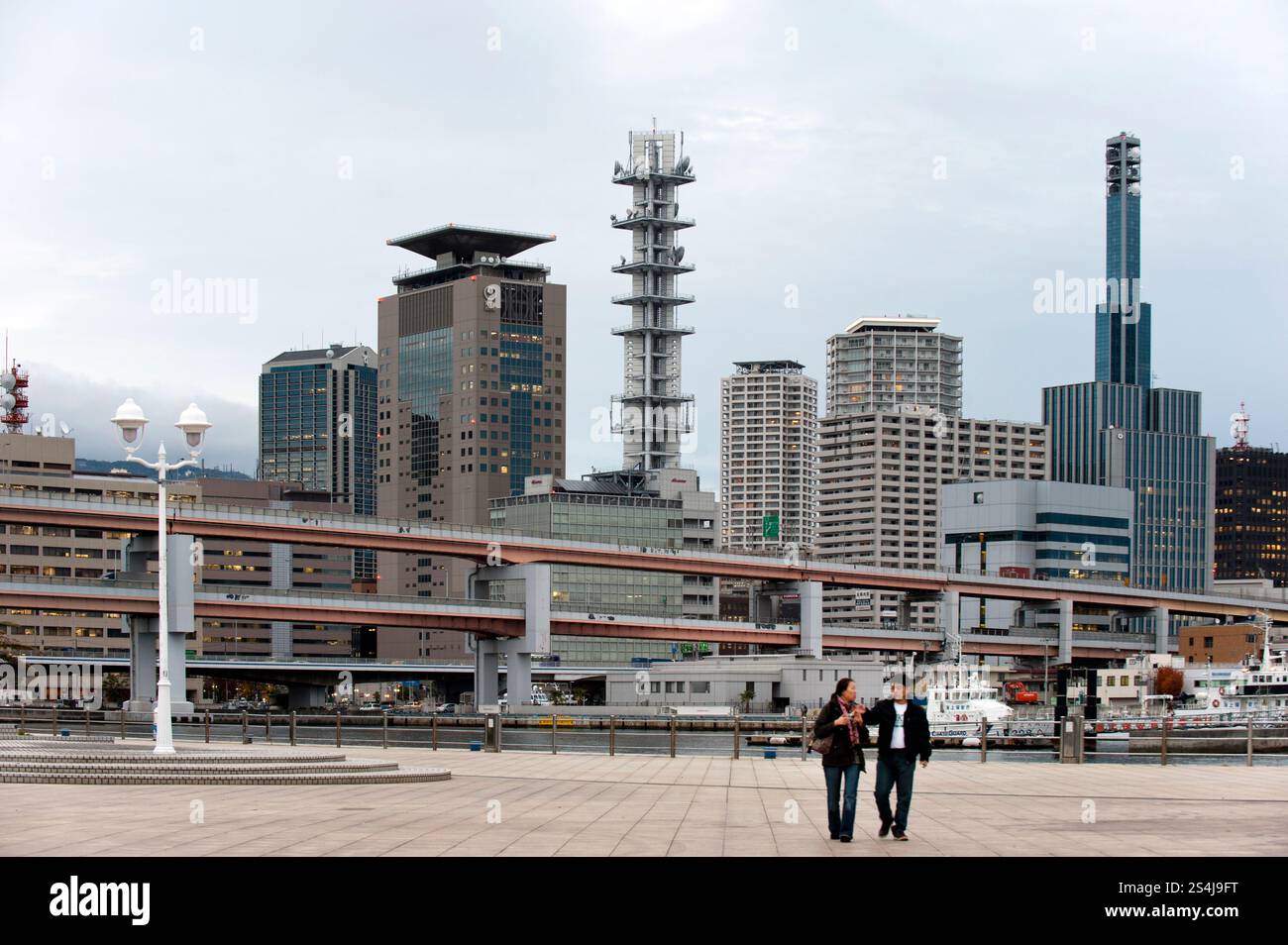 Double-decker freeway runs past skyscrapers in downtown Kobe waterfront ...