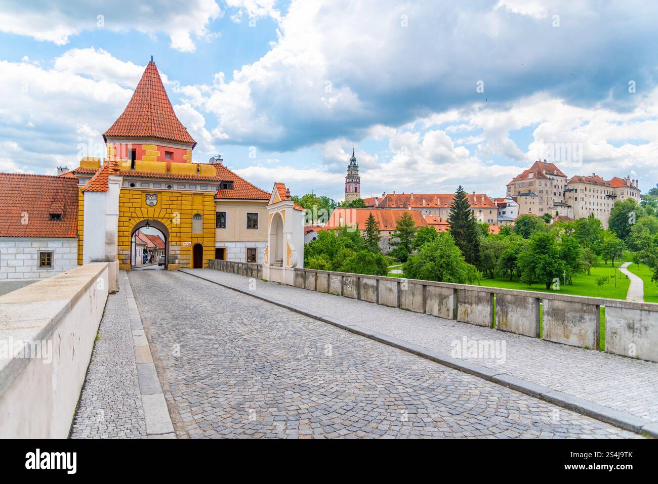 The Budweiser Gate stands proudly in Cesky Krumlov, surrounded by lush ...