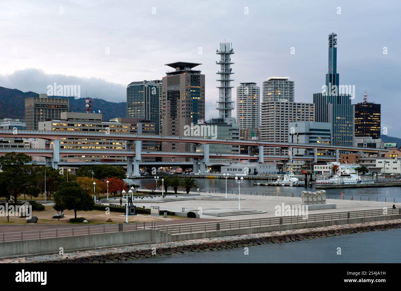 Double-decker freeway runs past skyscrapers in downtown Kobe waterfront ...
