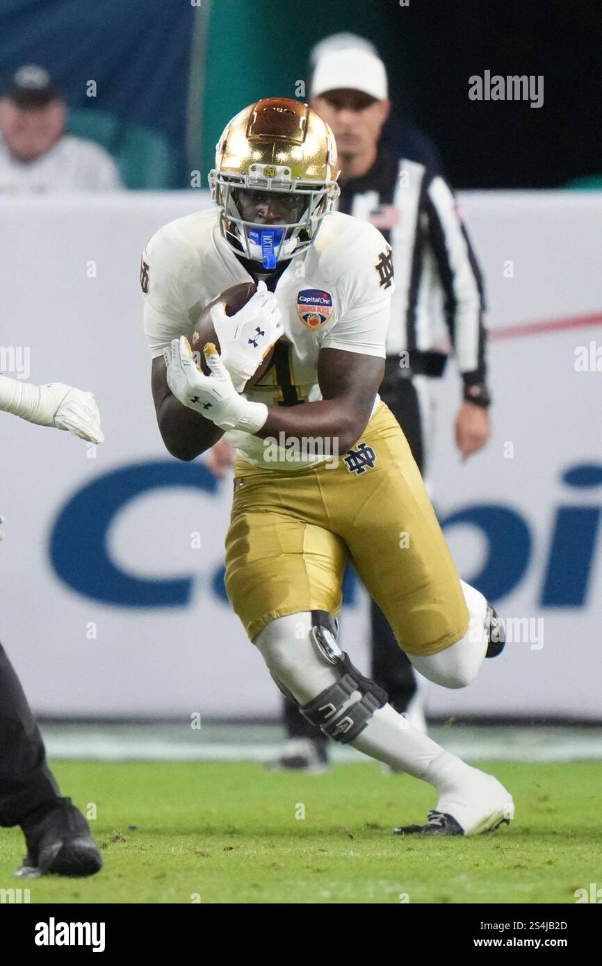 MIAMI GARDENS, FL - JANUARY 09: Notre Dame Fighting Irish running back Jeremiyah Love (4) rushes ...