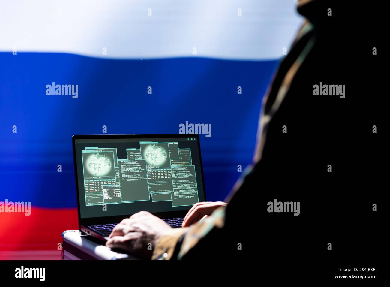 Russian soldier using military tech on laptop to identify threats from ...