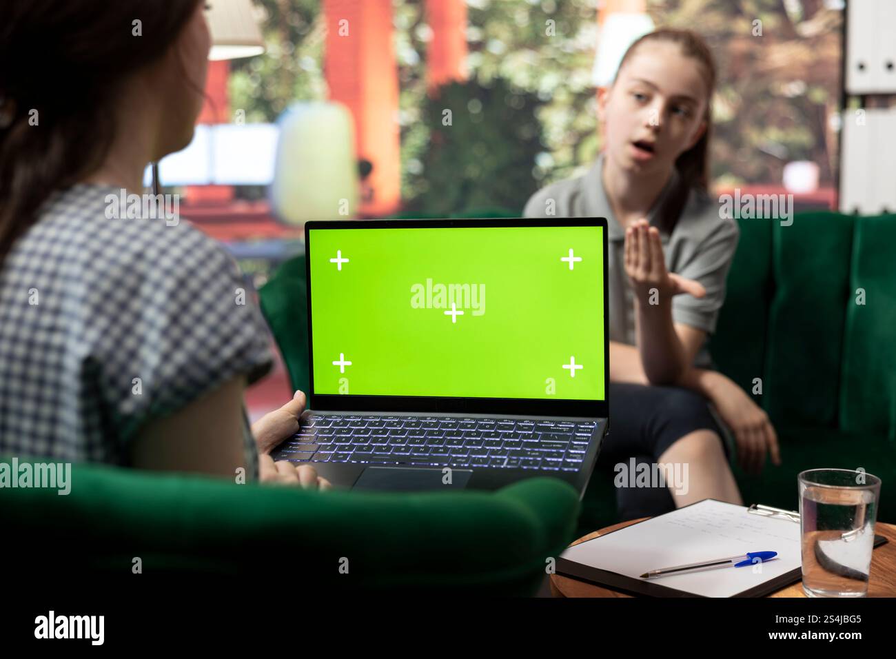 Teenager undergoing therapy for depression next to isolated chroma key ...
