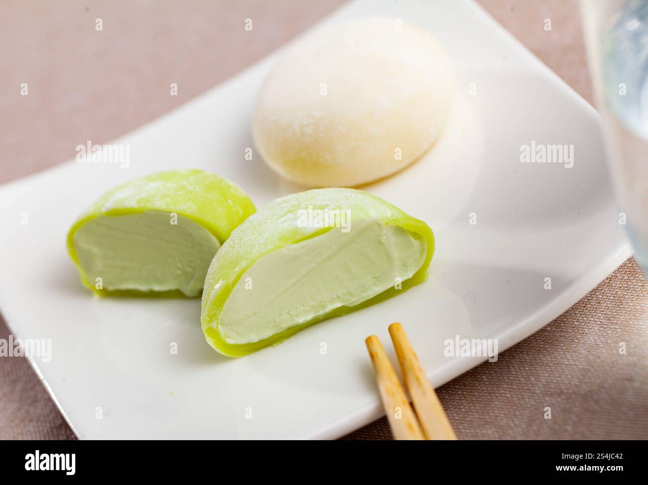 Mochi ice cream and wooden sticks on japanese plate closeup Stock Photo ...