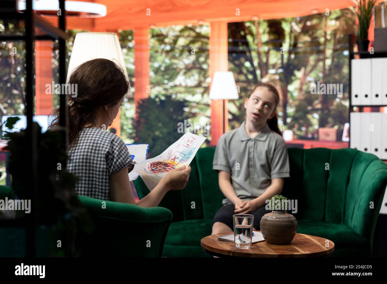 Young girl getting angry at psychologist when reviewing disturbing ...