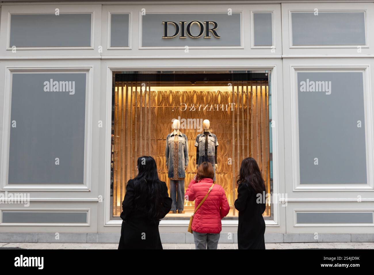 Window shoppers seen outside Dior shop, luxury fashion brand in central ...