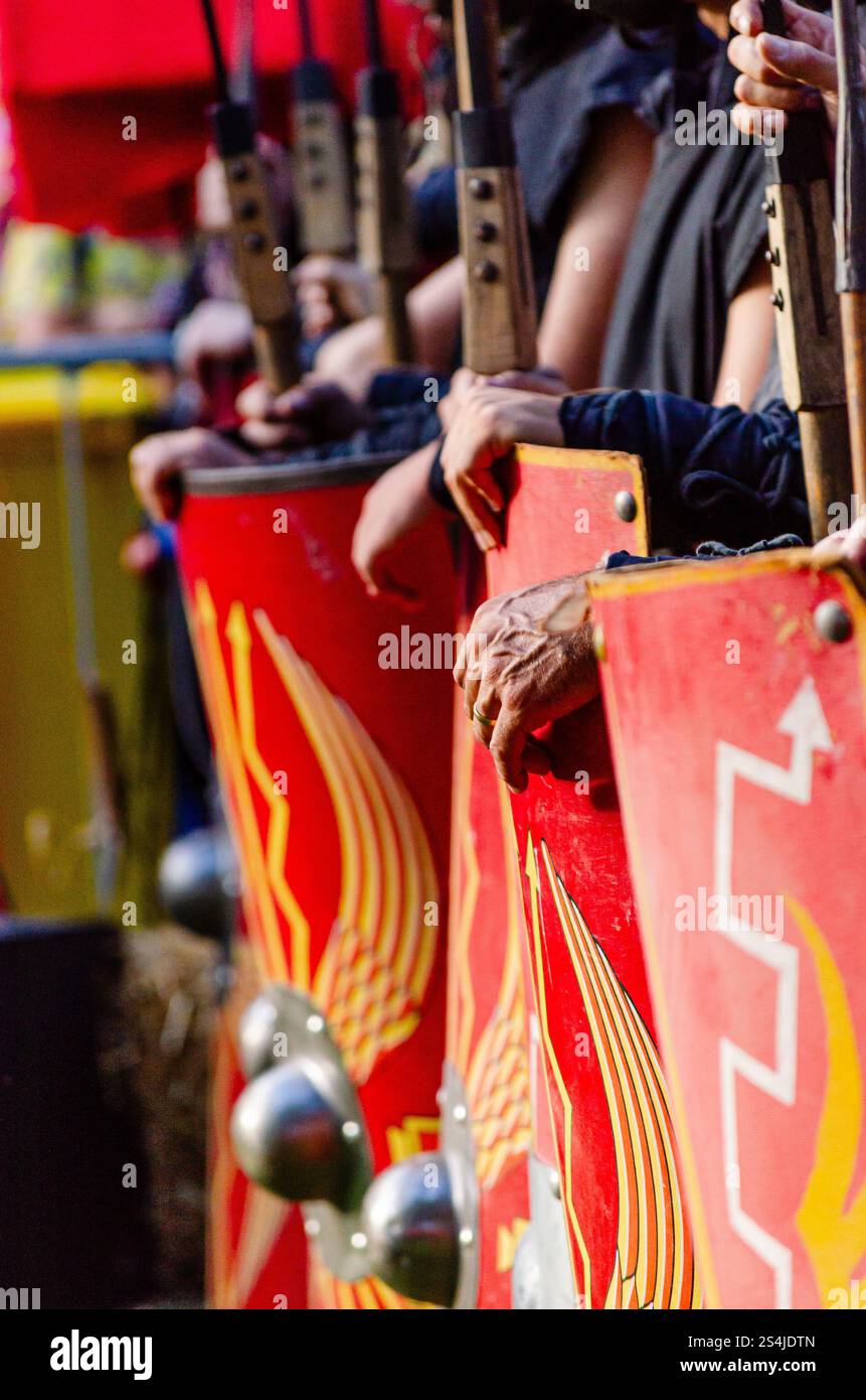 Roman legionary soldiers in formation at a historical reenactment party ...