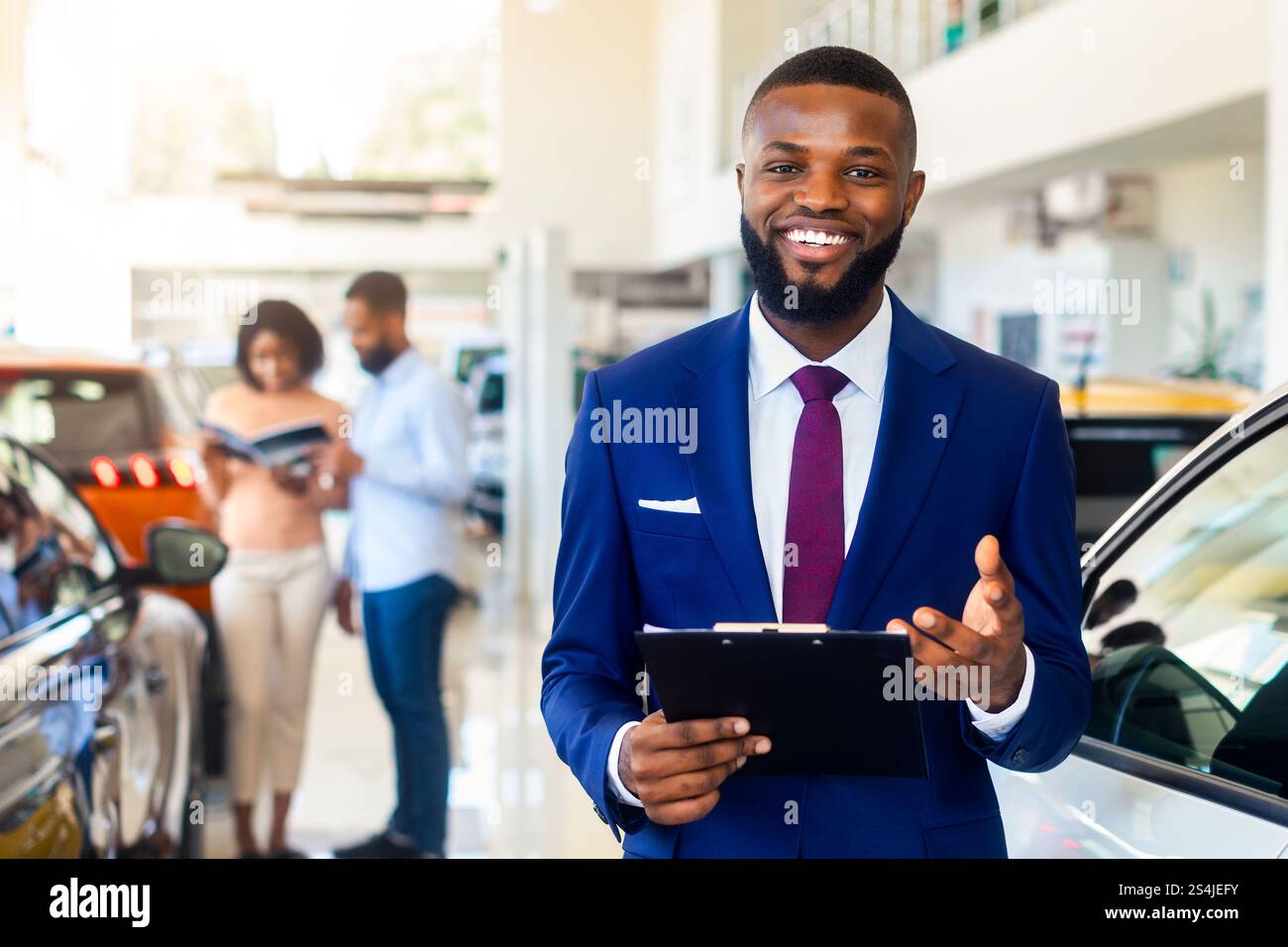 Car Dealership. Handsome Black Manager Posing At Workplace In Auto ...