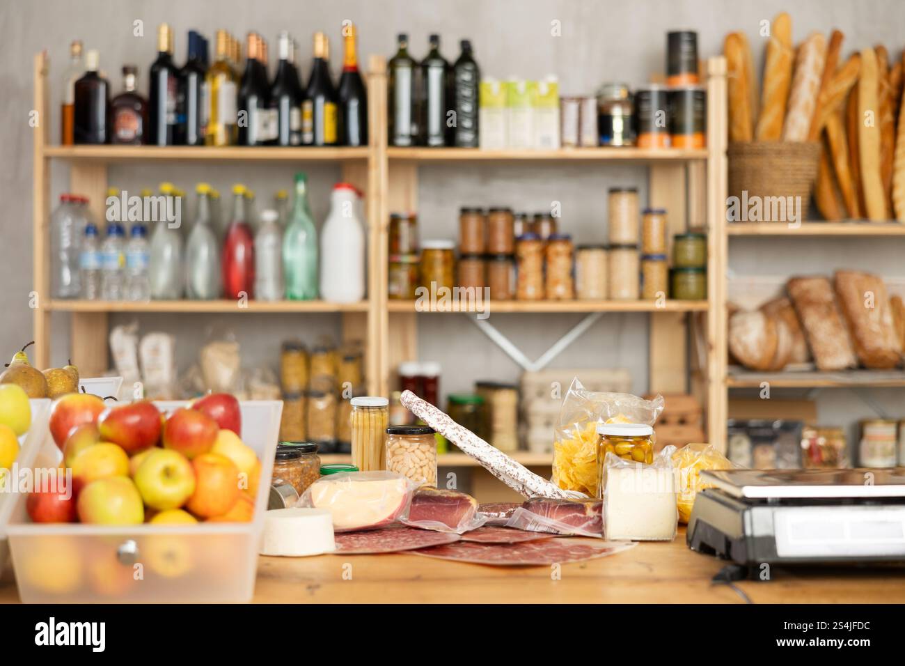 Different foods on grocery store counter Stock Photo - Alamy