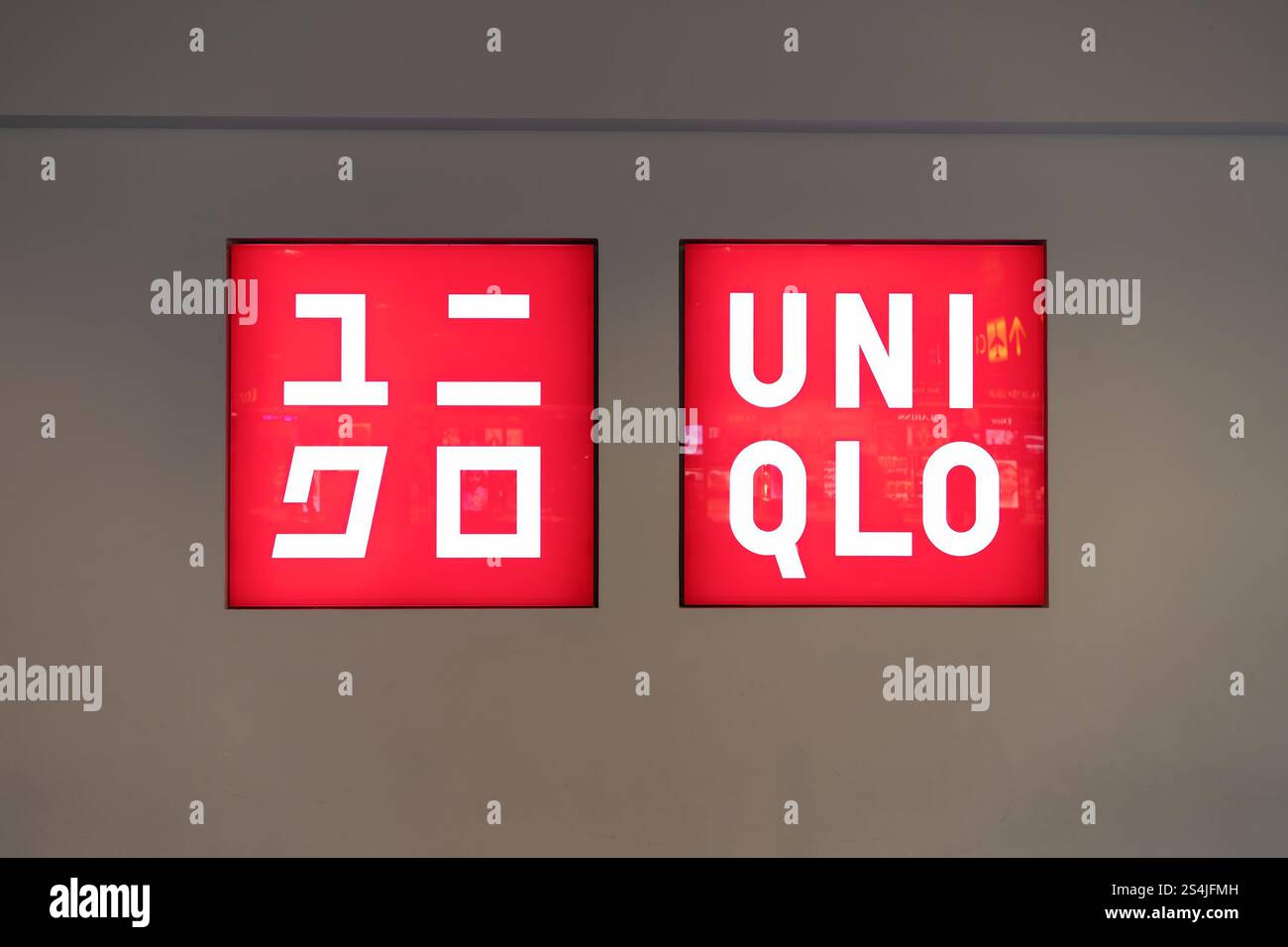 SINGAPORE - AUGUST 25, 2024: close up shot of Uniqlo sign as seen at Changi International ...