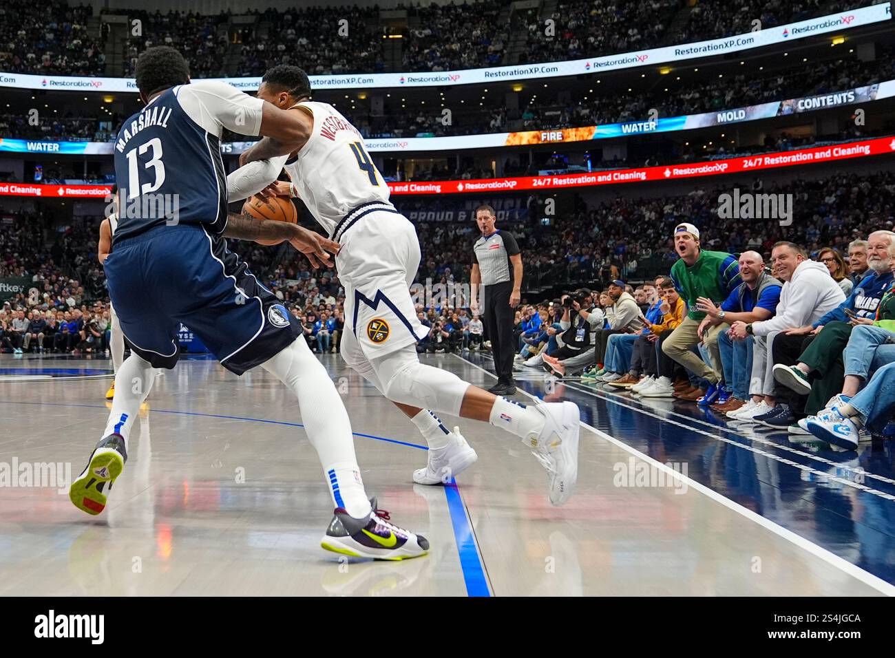 Hecklers, right, react as Denver Nuggets guard Russell Westbrook (4 ...