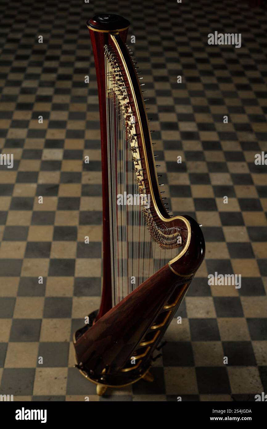 Vertical background shot of antique harp with elegant wooden frame ...