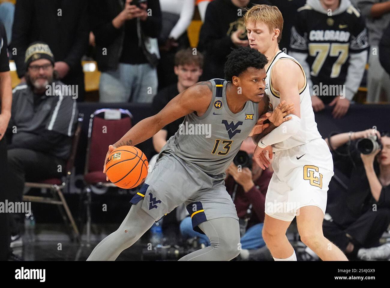 West Virginia forward Amani Hansberry (13) drives to the basket as ...