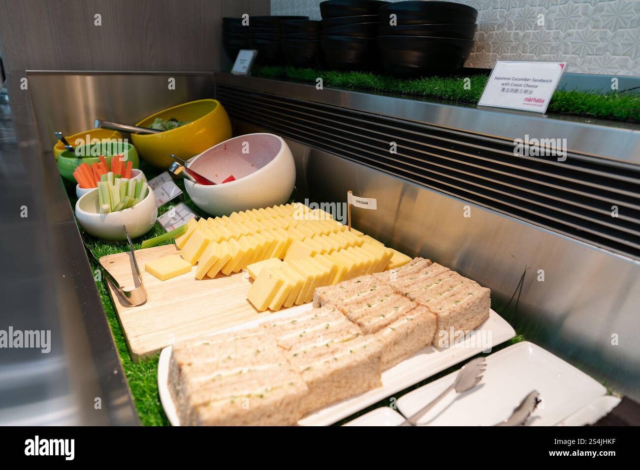 SINGAPORE - AUGUST 25, 2024: a spread of salad ingredients, cheese and ...