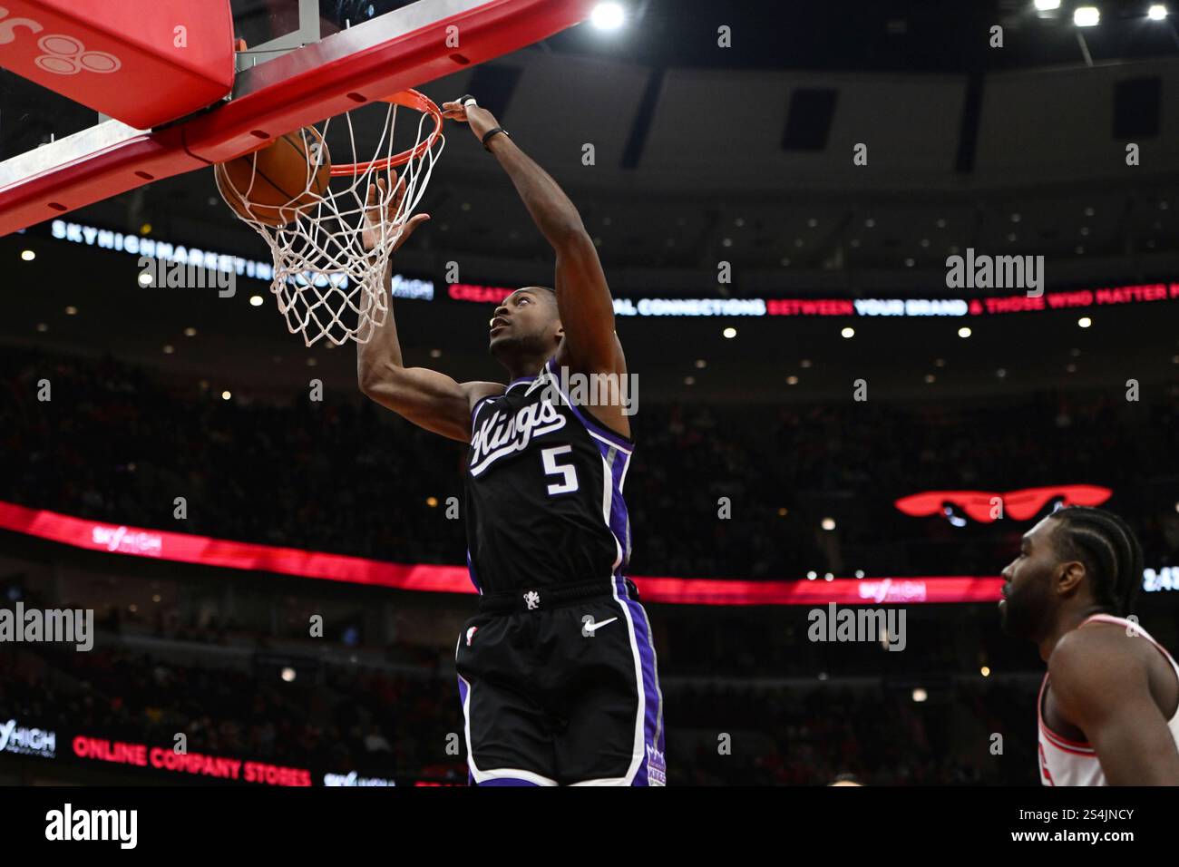 Sacramento Kings' De'Aaron Fox (5) dunks during the first half of an ...