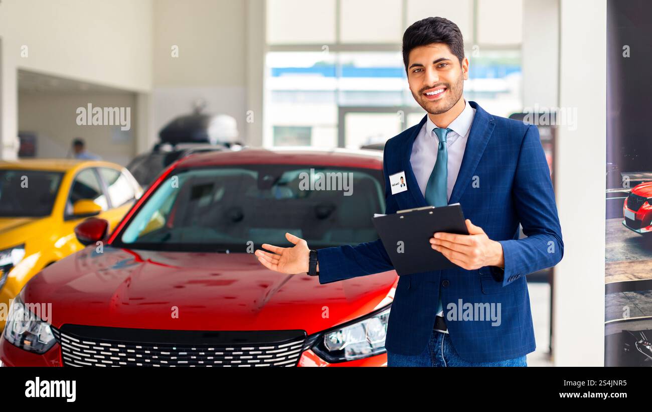 Sales manager showing brand new automobile, holding chart Stock Photo ...