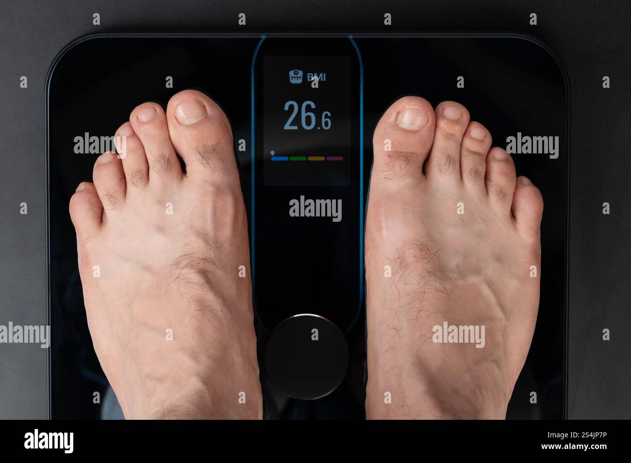 Checking BMI level on weight scale close up view Stock Photo - Alamy