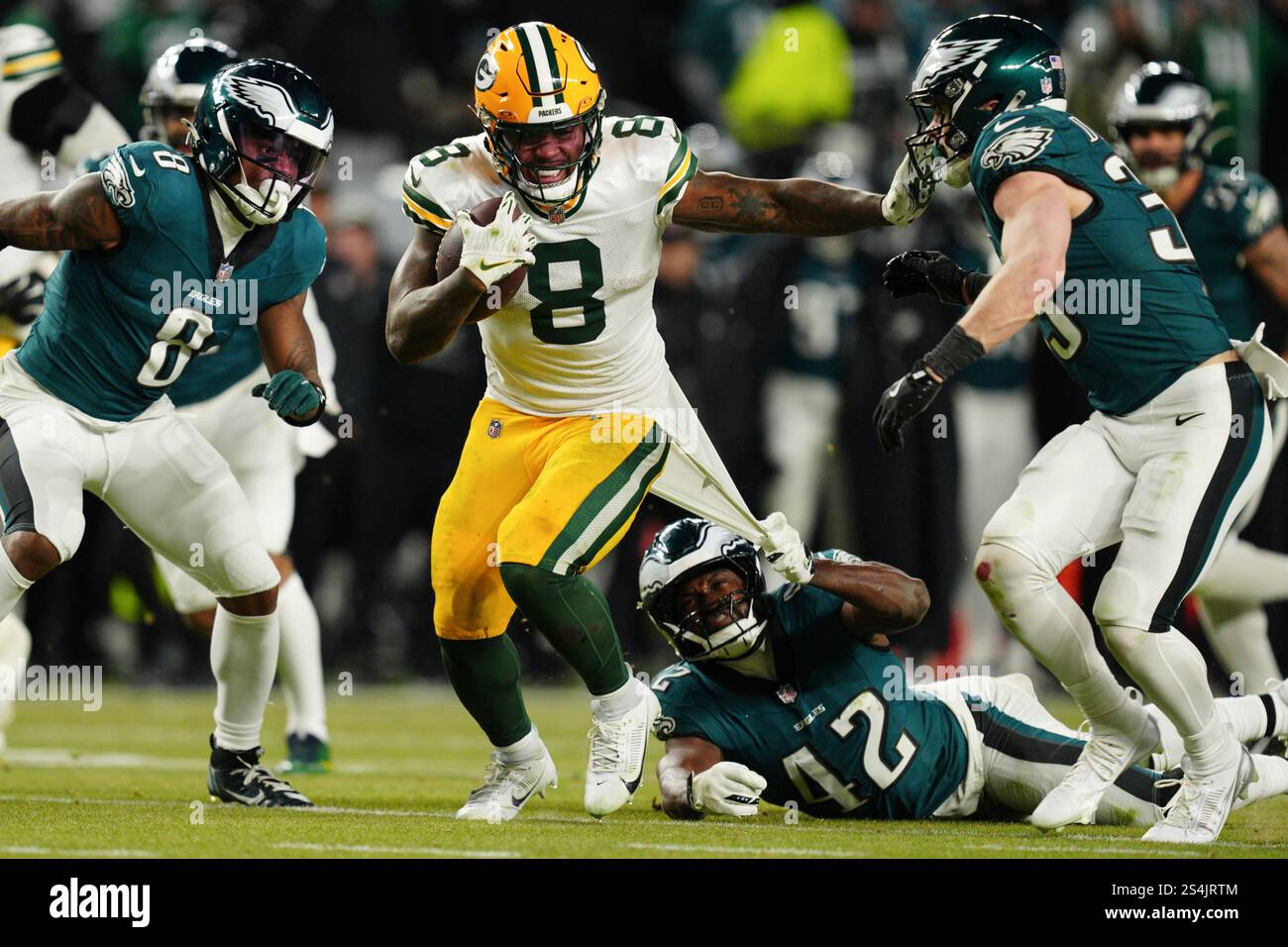 Green Bay Packers running back Josh Jacobs (8) runs the ball as ...