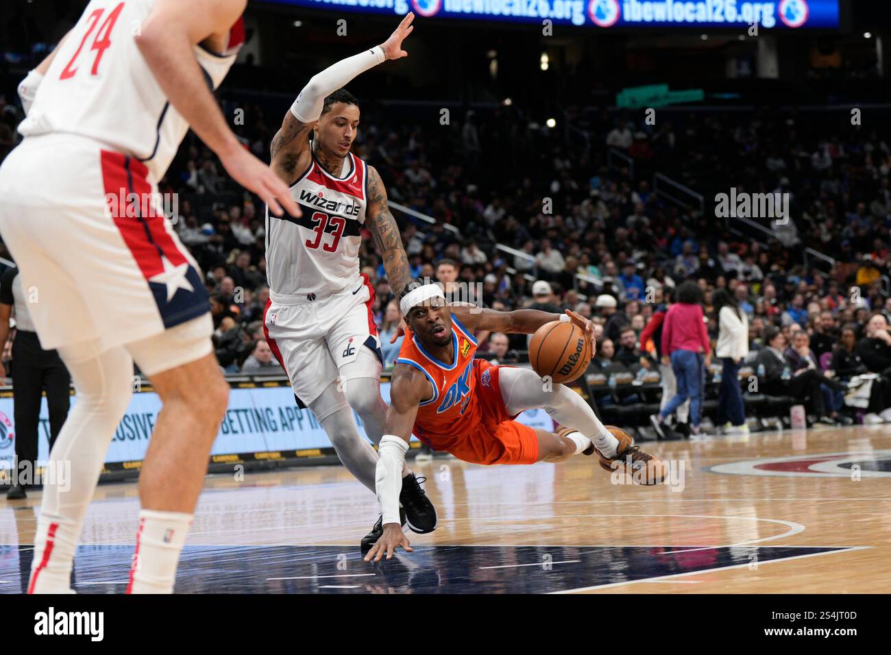 Oklahoma City Thunder guard Shai Gilgeous-Alexander, right, falls after being fouled by ...