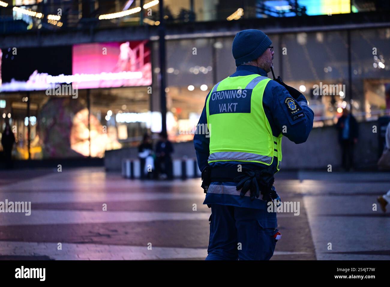 Stockholm, Uppland, Sweden. December 28 2024. Security guard on Sergels ...