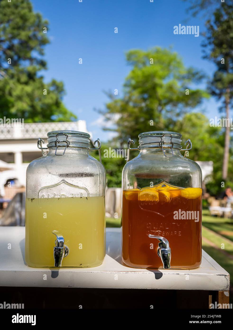 Lemonade and Tea In Glass Jars With Serving Spouts in outdoor party ...