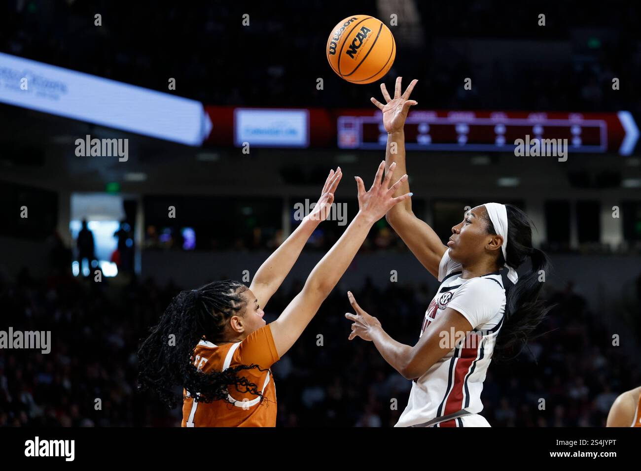 South Carolina guard Bree Hall, right, shoots over Texas guard Jordan ...