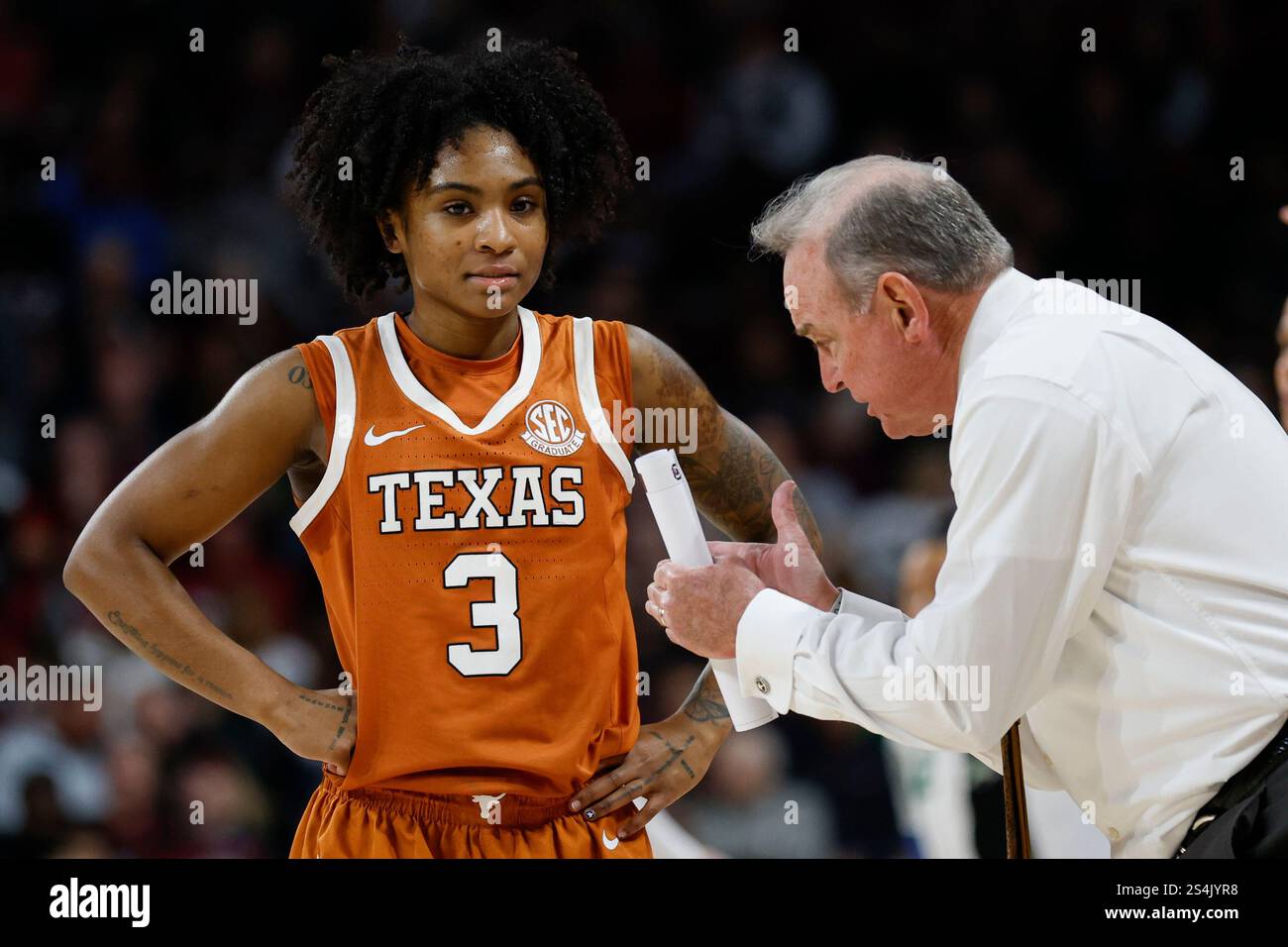 Texas head coach Vic Schaefer, right, talks to guard Rori Harmon during the first half of an ...